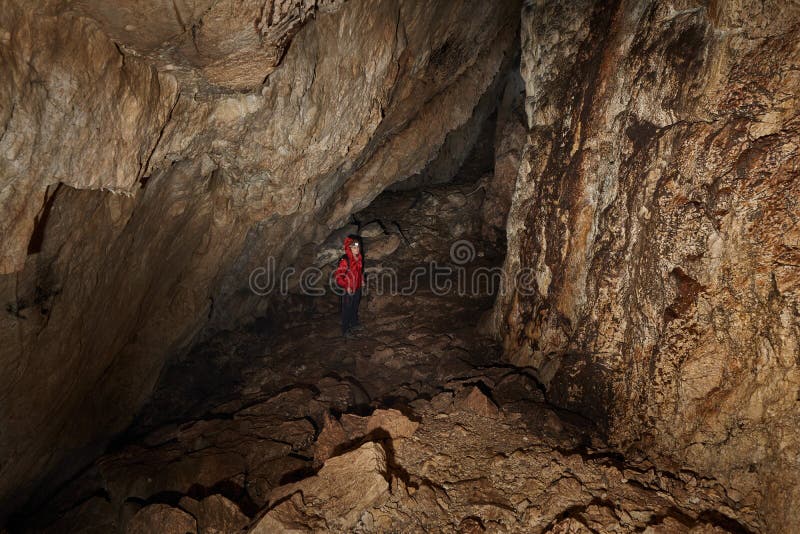Woman explorer in a cave stock photo. Image of jurassic - 252875362