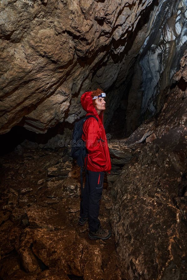 Woman explorer in a cave stock photo. Image of gours - 252875368