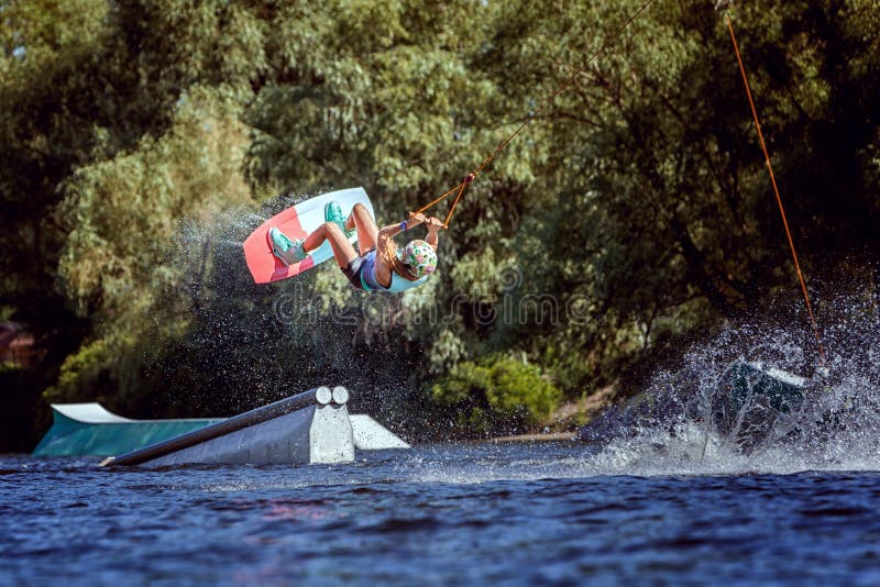 Woman is an Extreme in a Jump Over the Water. Stock Image - Image of ...