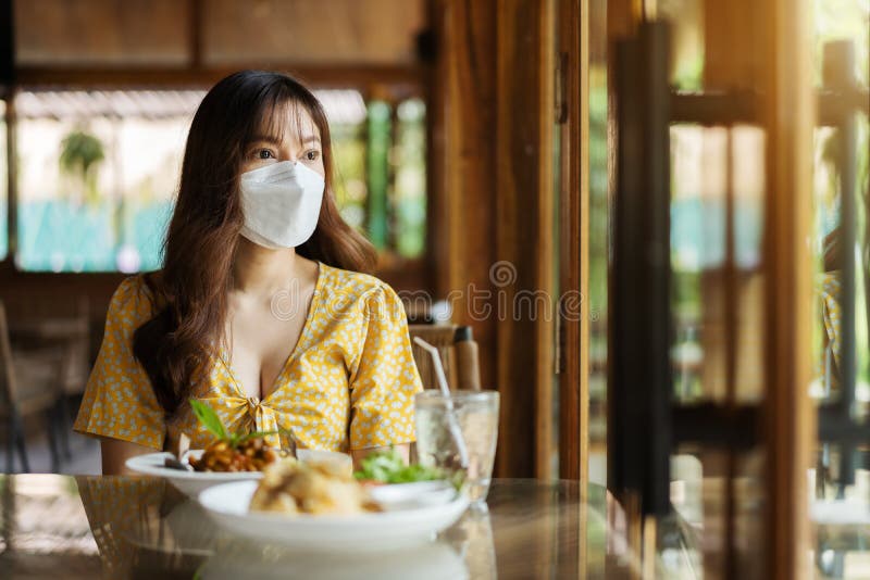 Woman with a Face Mask in Restaurant Stock Photo - Image of dinner ...