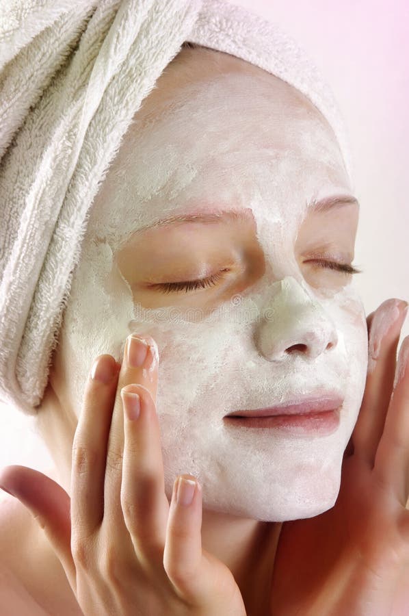Facial Mask on Beautiful Face Stock Photo - Image of hand, portrait ...