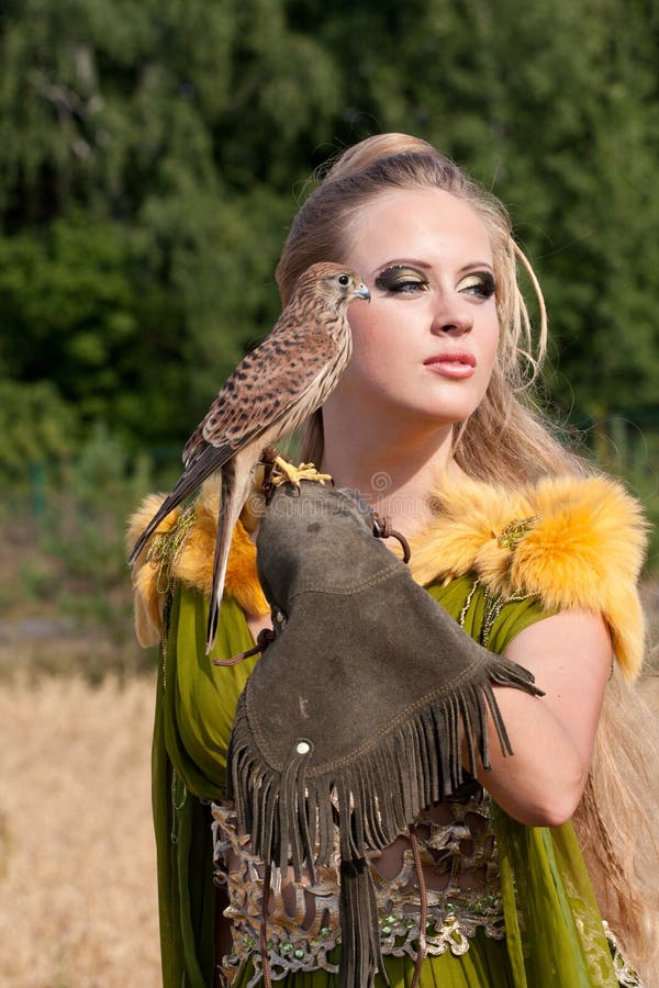 The woman with falcon stock photo. Image of princess - 20798212