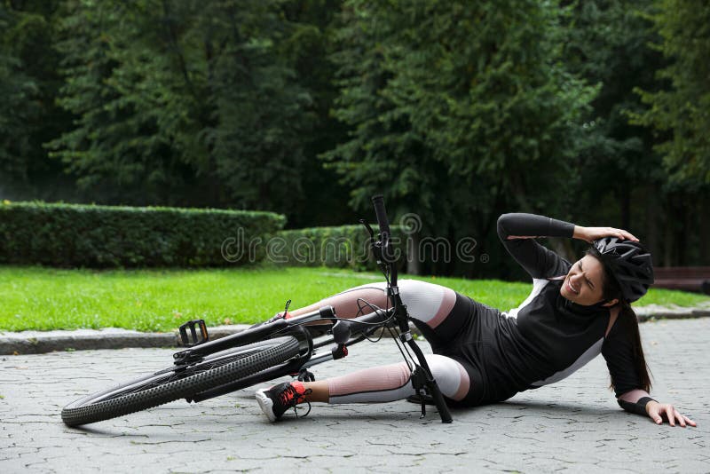 Young Woman Fallen Off Her Bicycle in Park Stock Image - Image of ...