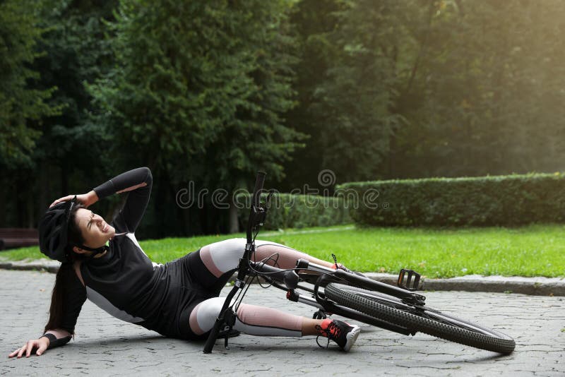 Young Woman Fallen Off Her Bicycle in Park Stock Image - Image of girl ...