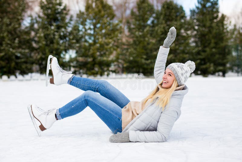 Woman Falling Down while Ice Skating at Winter Rink Stock Image - Image ...