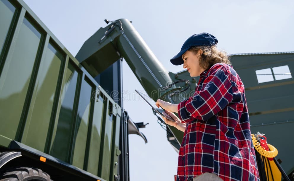 Woman Farmer with Tablet Watching Grain Loading Stock Image - Image of ...
