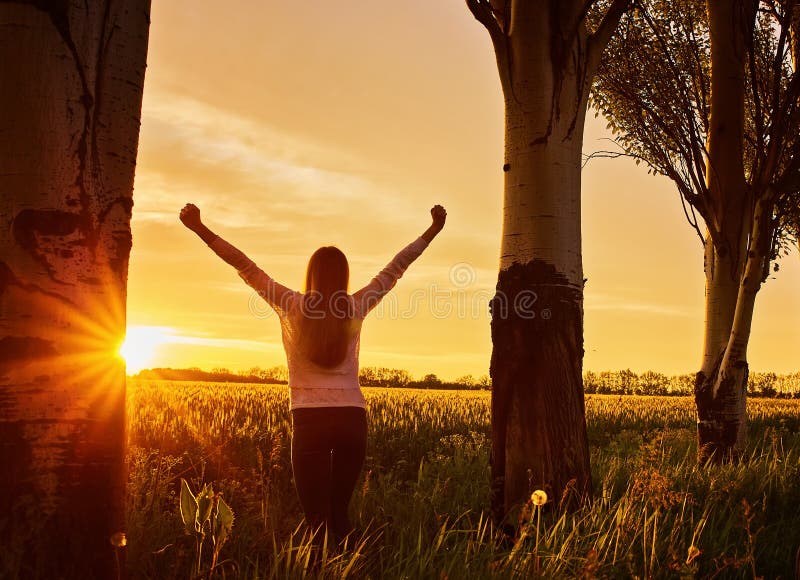 Woman Feeling Victorious Facing the Beautiful Sunset Stock Image ...