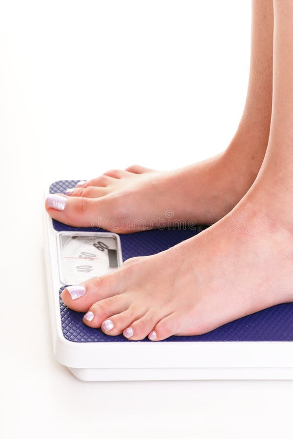 Woman Feet and Weight Scale Isolated on White Background Stock Photo ...