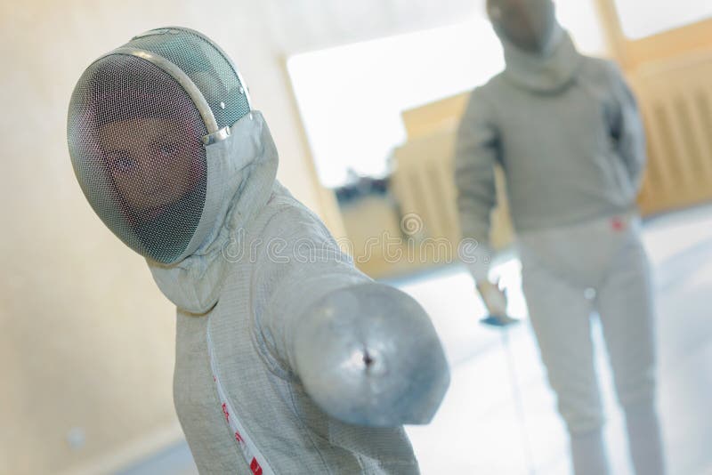 Woman in fencing posture stock image. Image of indoors - 123598495