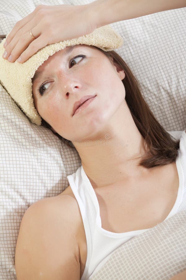 Woman with fever in bed stock photo. Image of lying, woman - 17129514