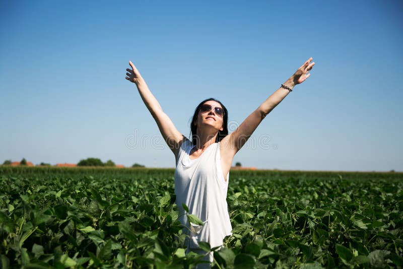Woman in Field Smiling and Spreading Hands Happy Stock Photo - Image of ...