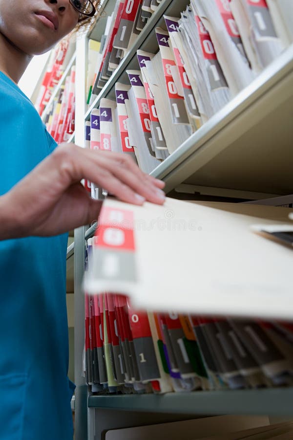 Woman with File in Hospital Archives Stock Image - Image of assistant ...