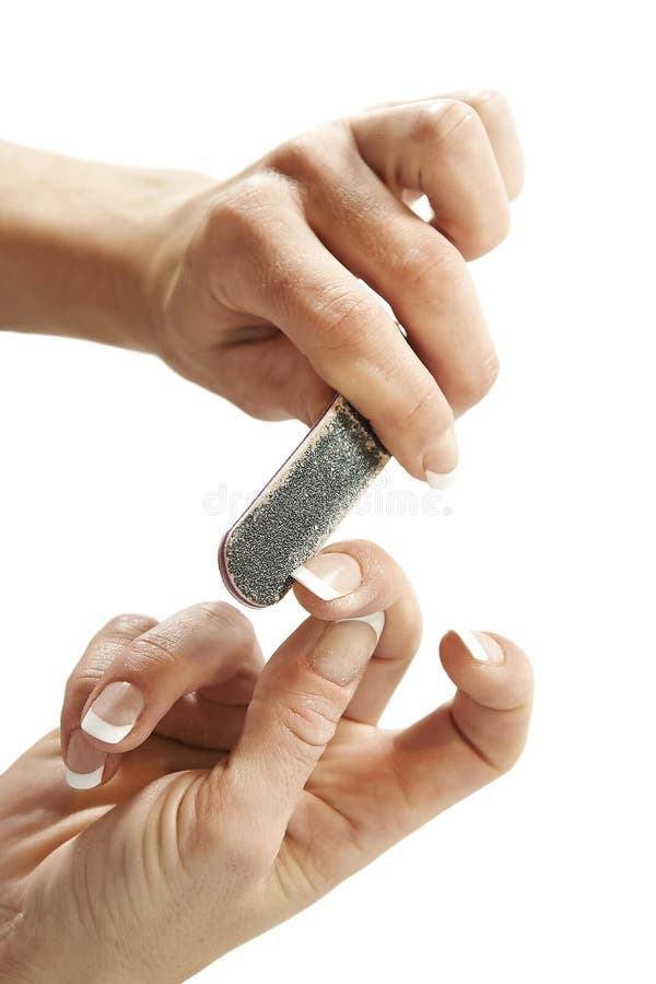 Woman filing her nails stock image. Image of beautician - 30523837