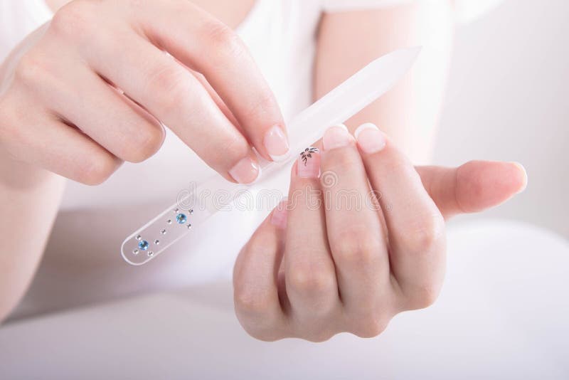 Woman filing her nails stock photo. Image of polish, french - 36244528