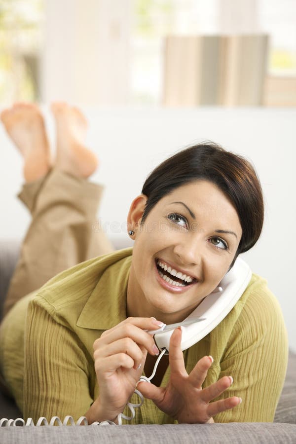 Woman Filing Nails while Chatting Stock Photo - Image of domestic, cosy ...
