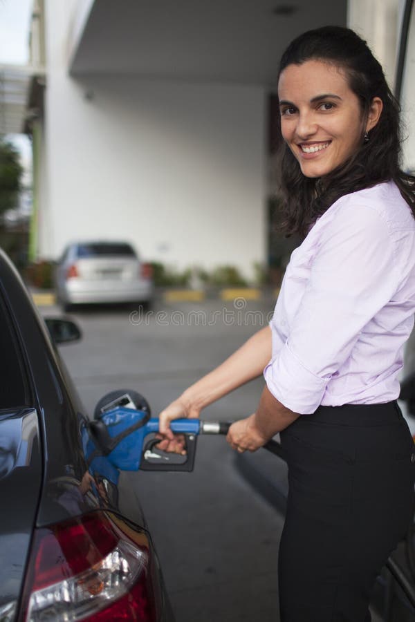 Woman fill up car stock image. Image of pretty, girl - 22700427