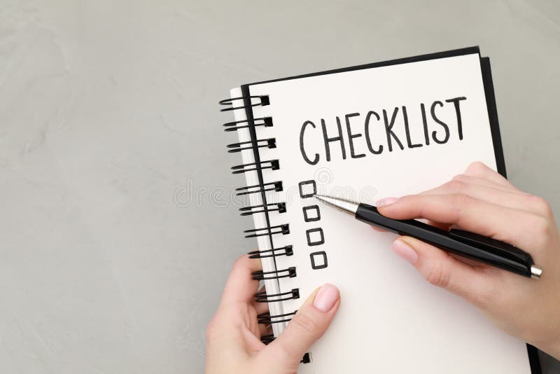 Woman Filling Checklist at Light Grey Table, Top View. Space for Text ...