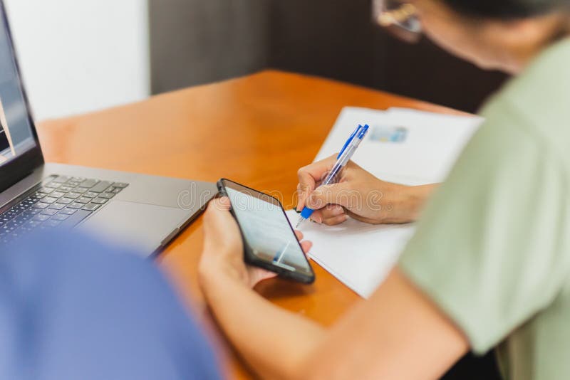 Woman Filling Document Paper Work Hand Holding Cell Phone Stock Photos ...