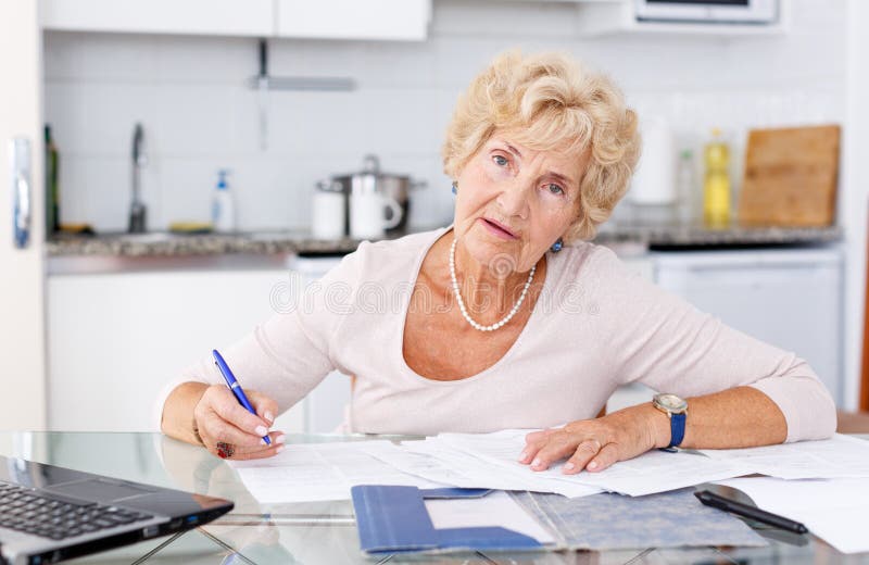Woman filling up documents stock image. Image of papers - 242286641