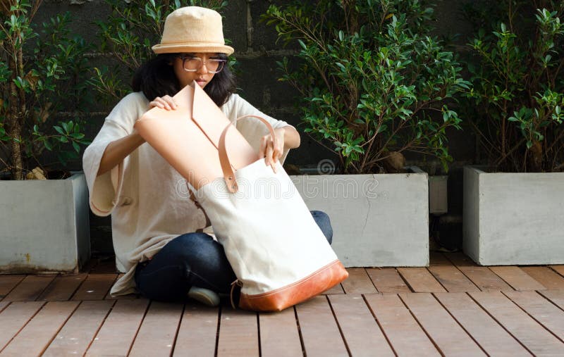 Woman Finding Something in a Canvas Bag Stock Image - Image of deck ...