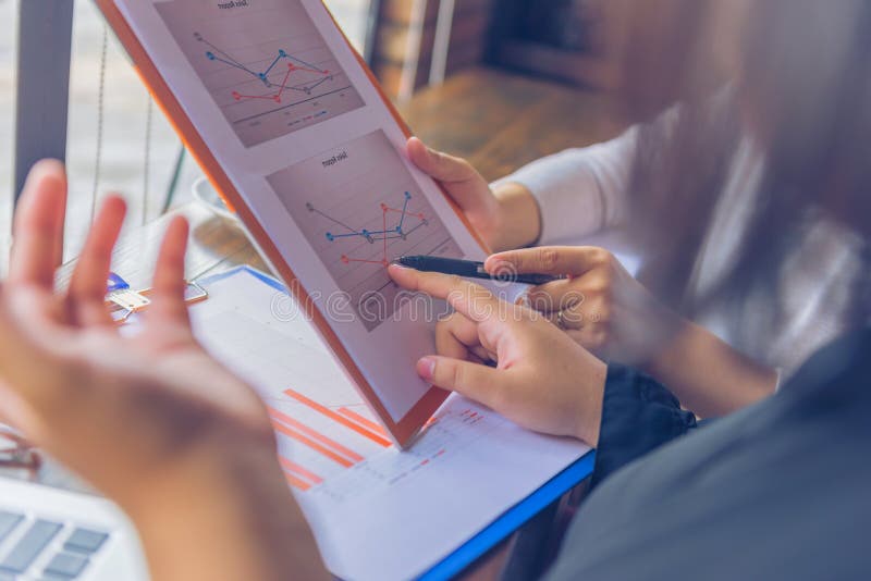 Woman Finger Pointing Business Document in Office Stock Photo - Image ...