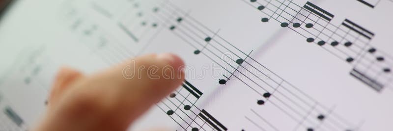 Woman Finger Points To Musical Notes. Classical Music and Music ...