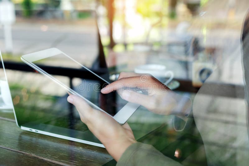 Woman Finger Touching on Digital Tablet See through Glass in Coffee ...