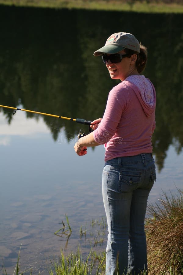 Woman Fishing at a lake stock image. Image of girl, lifestyle - 28077797