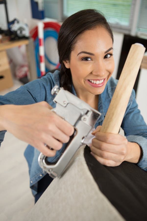 Woman Fixing Chair with Staple Stock Photo - Image of genderequality ...