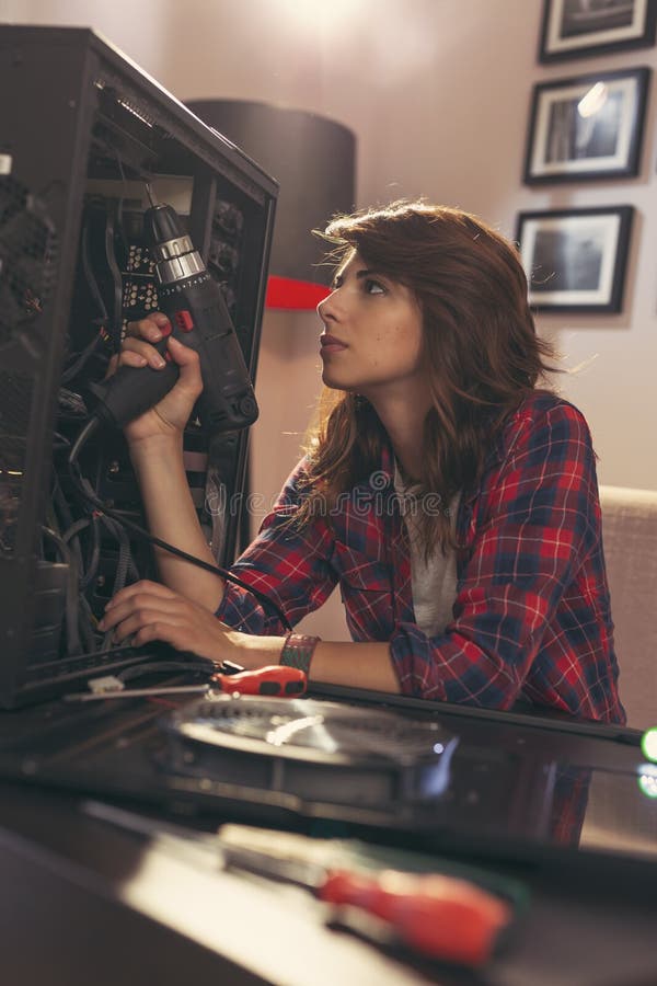 Woman fixing a computer stock image. Image of employment - 116895485
