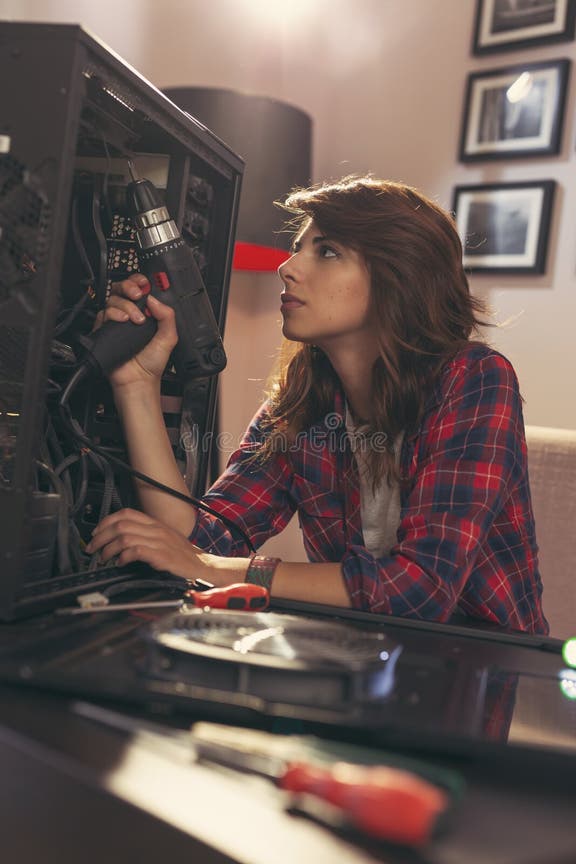 Woman fixing a computer stock image. Image of employment - 116895485