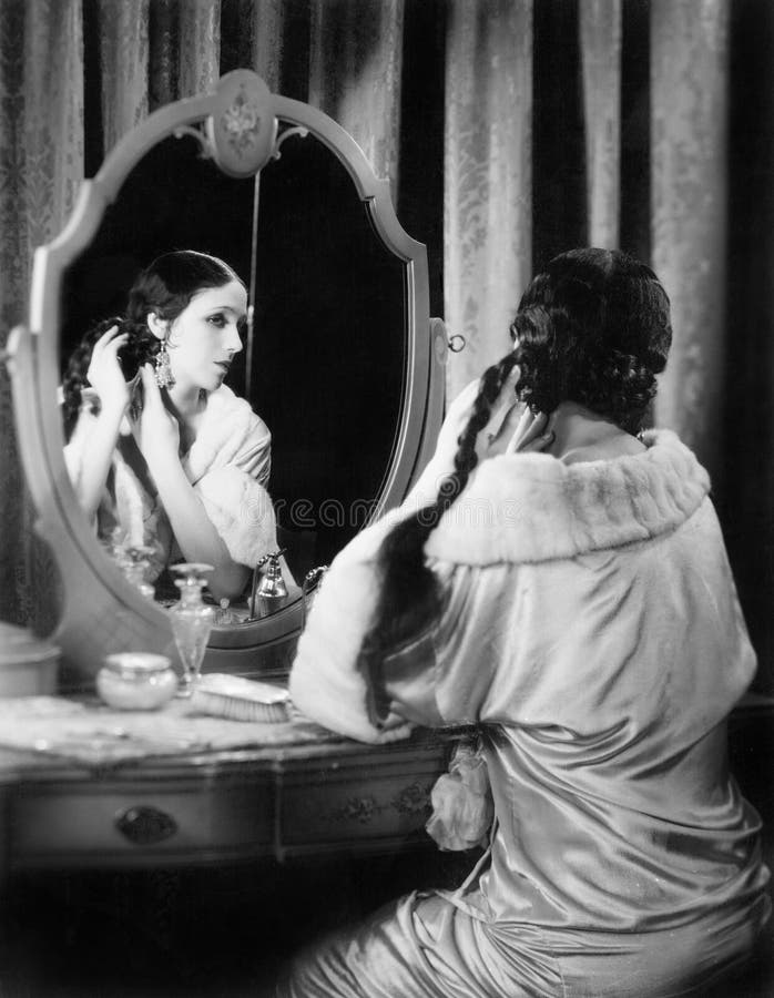Woman Fixing Her Long Hair at Her Vanity Table Stock Image - Image of ...