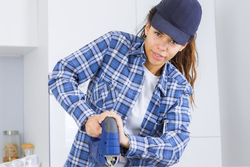 Woman Fixing Kitchen Furniture Stock Image - Image of laborer, cabinet ...