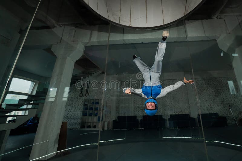 A Woman Flies in a Wind Tunnel. Free Fall Simulator. Stock Image ...