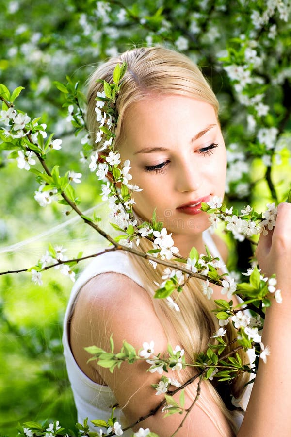 Woman by flowers on tree stock image. Image of flowering - 9389057