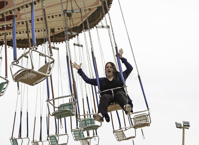 Woman on flying swings stock photo. Image of cheerful - 81241328