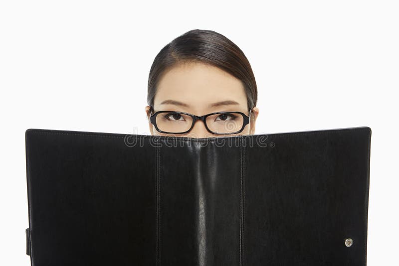 Woman with a Folder Covering the Bottom Part of Her Face Stock Image ...