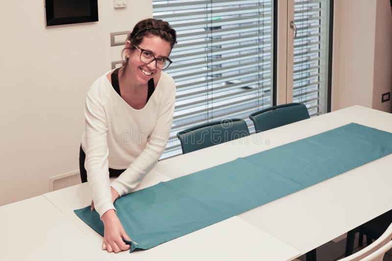 Woman Folding Fabric in Modern Home Living Room Setting Stock Image ...