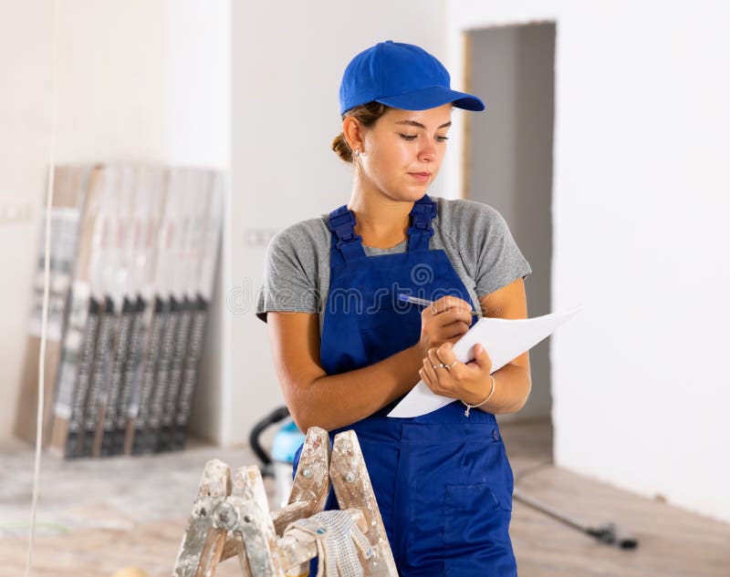 Woman Foreman Checks the Completed Construction Work on Drawing Stock ...