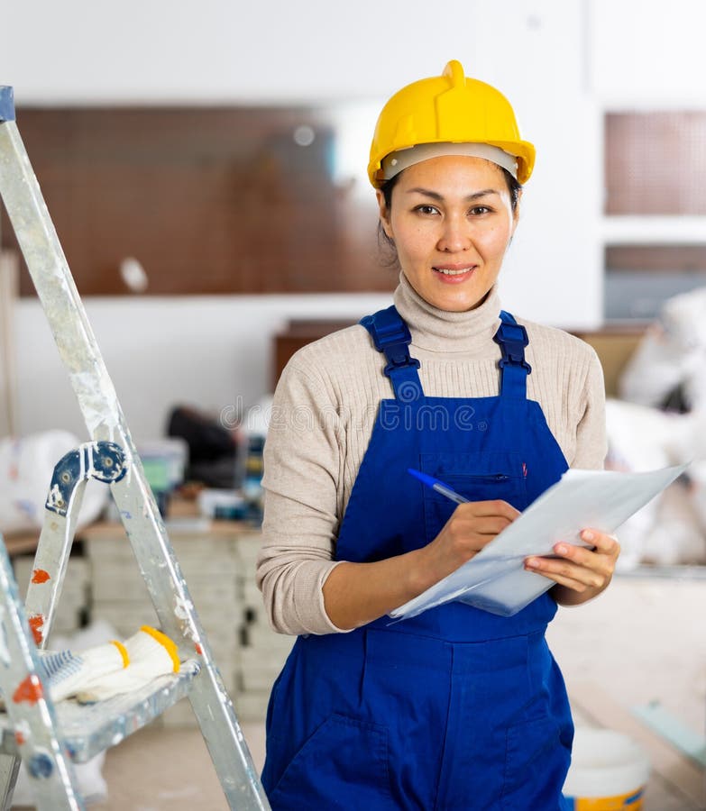 Woman Foreman Checks the Completed Construction Work on Drawing Stock ...