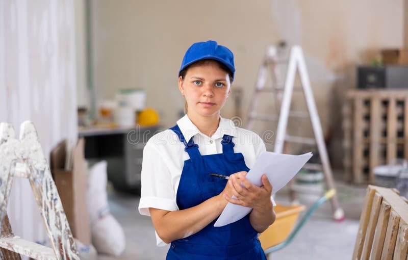 Woman Foreman Checks the Completed Construction Work on Drawing Stock ...