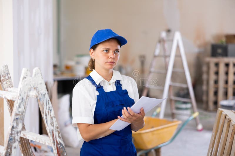 Woman Foreman Checks the Completed Construction Work on Drawing Stock ...