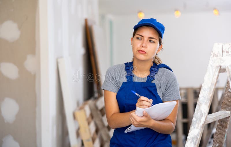 Woman Foreman Checks the Completed Construction Work on Drawing Stock ...