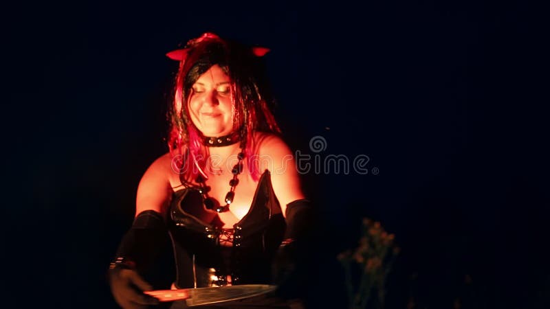 A Woman in the Form of a Devil at Night by the Fire with a Knife before ...