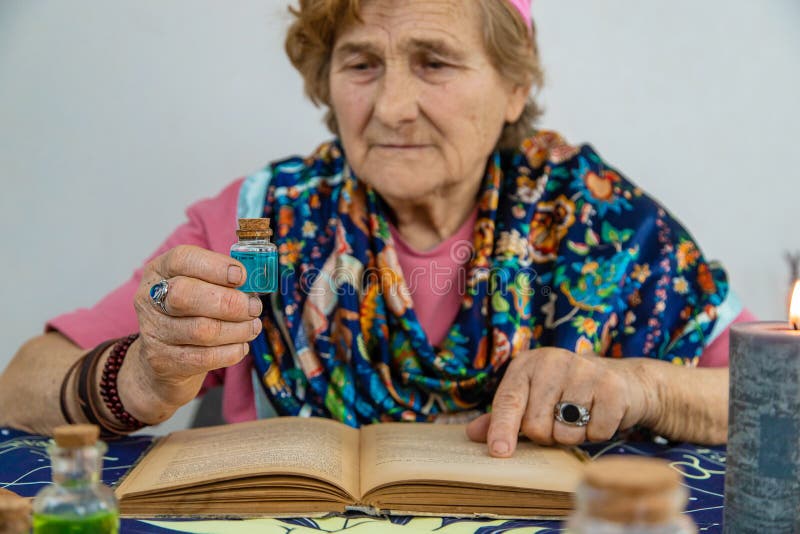Woman Fortune Teller Prepares a Potion. Selective Focus Stock Image ...