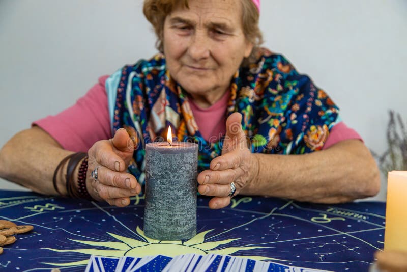 Woman Fortune Teller Fortune Telling on a Candle. Selective Focus Stock ...