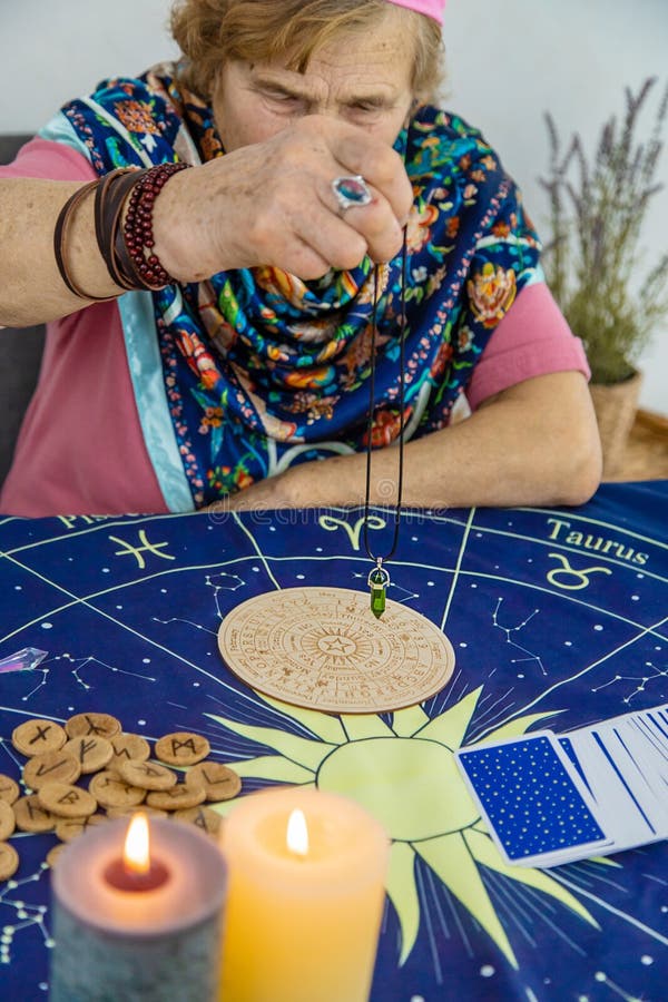 Woman Fortune Teller Fortune Telling Pendulum. Selective Focus Stock ...