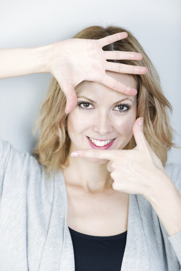 Woman framing her face stock image. Image of modern, face - 56740013