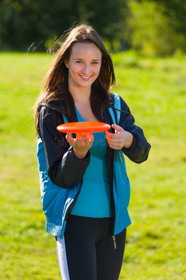Woman and frisbee stock photo. Image of hobby, outside - 26555674