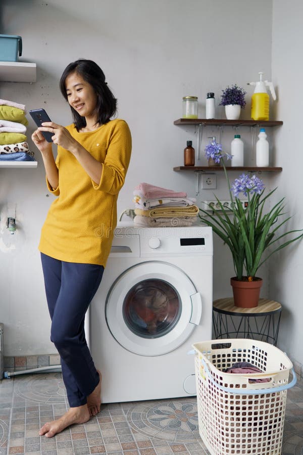 223 Washing Machine Lady Loading Stock Photos - Free & Royalty-Free ...